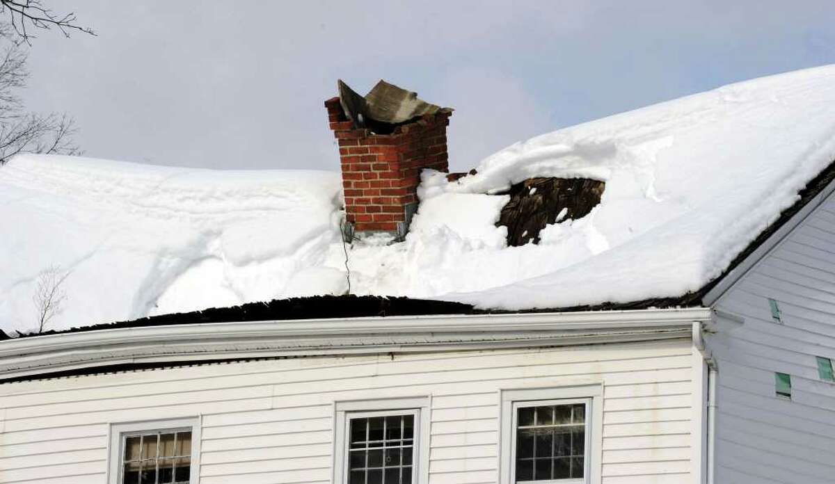 Weighted with snow and ice, two roofs in Newtown collapse; officials in ...