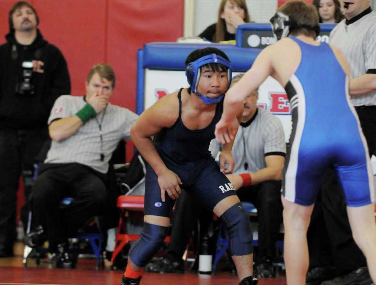 Now Myint thrives on wrestling mat