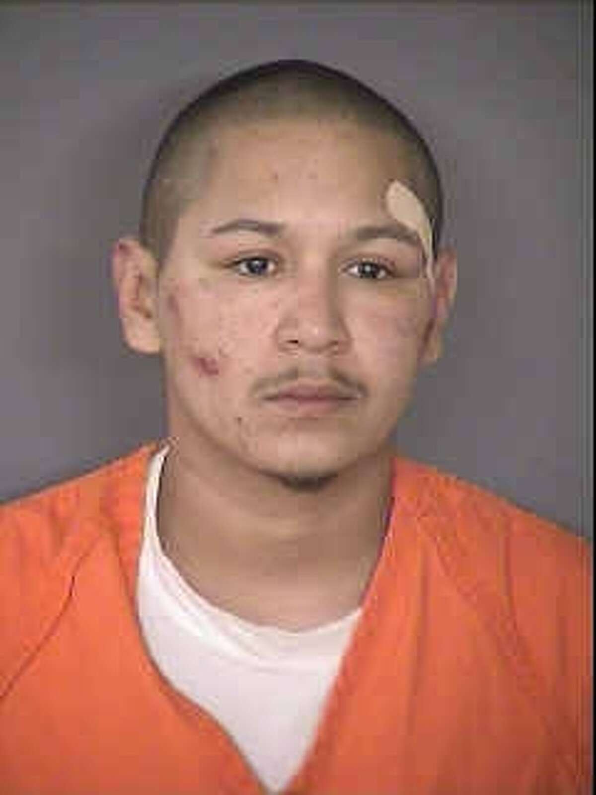 Police arrest man suspected of shooting woman, stealing car