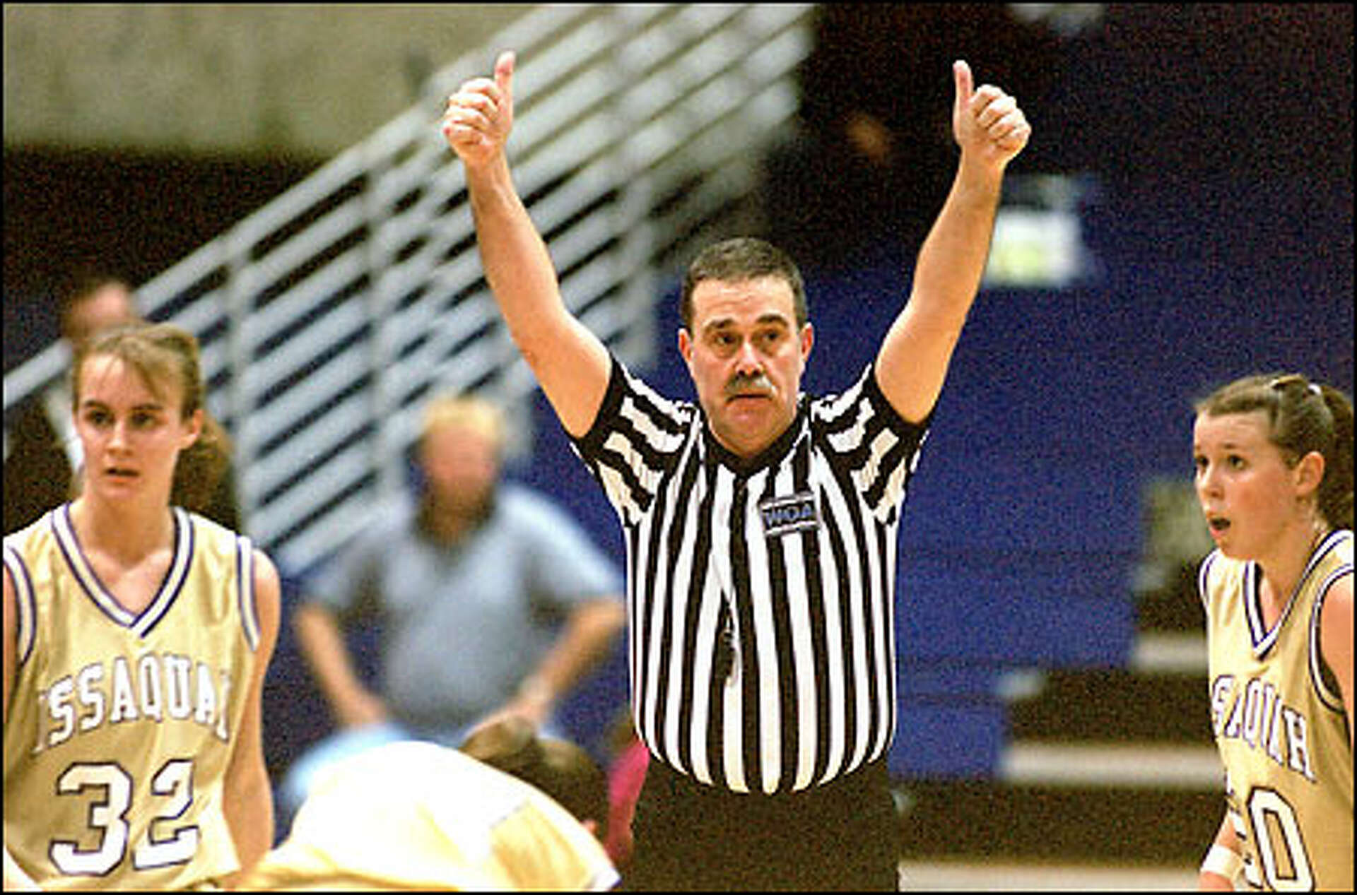 Referees whistle while they work; love of game outweighs demands