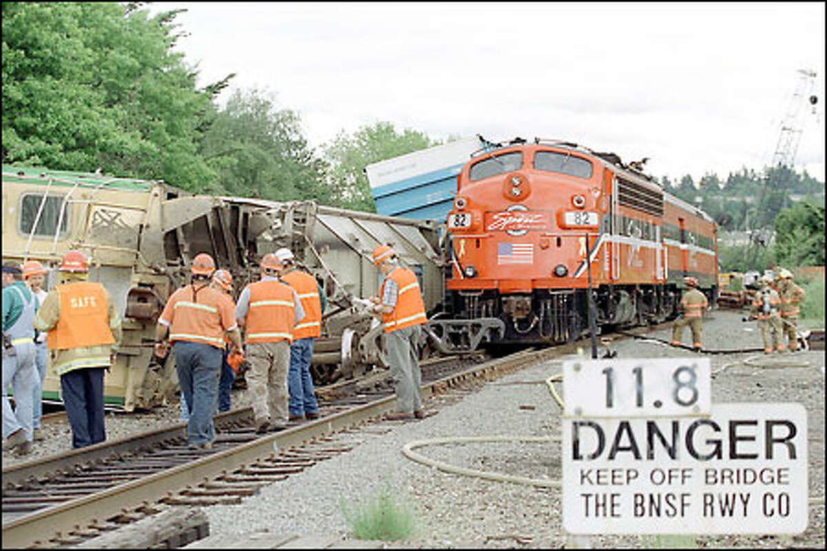 Freight train derails, damages dinner train