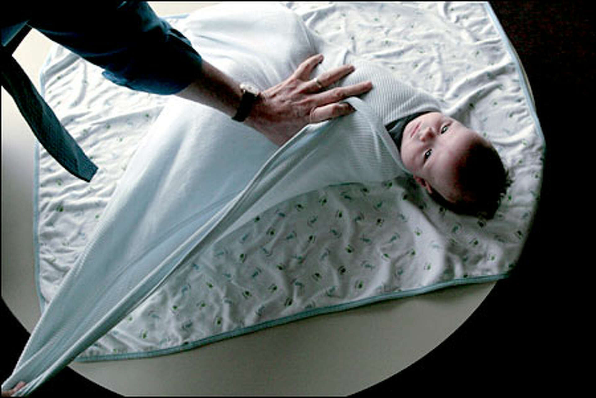 Shhh.... UCLA pediatrician develops the 'Cuddle Cure' to calm colicky ...