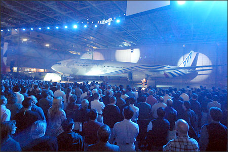 Boeing rolls out new 777 model, with designs on another plane