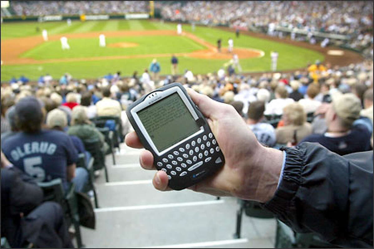 Dialing for a dog and drink from the seats at Safeco Field