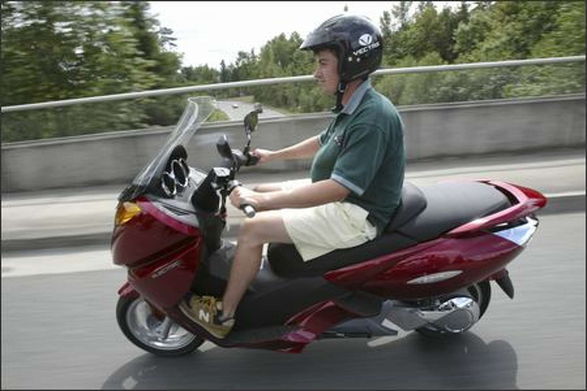 Seen/scene: No roar, no smoke -- the Vectrix scooter is all electric