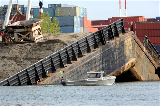 Barge delivering gravel breaks