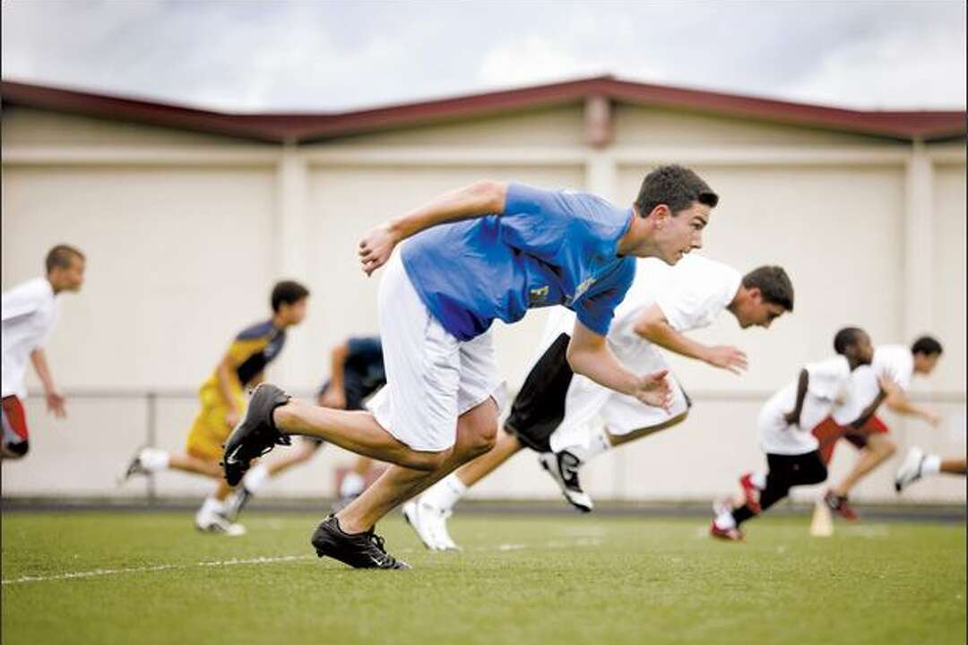 Huskies football summer games: No offseason for some