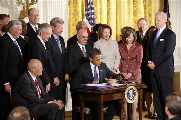Obama signs bill giving millions of uninsured children health care