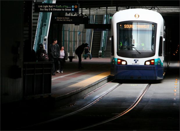 Light-rail trains start simulated service beside buses in transit tunnel