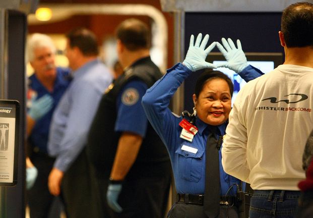 Airport security looks at people who complain about ... airport ...