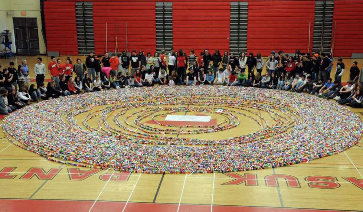 Masuk students construct record-breaking pi paper chain