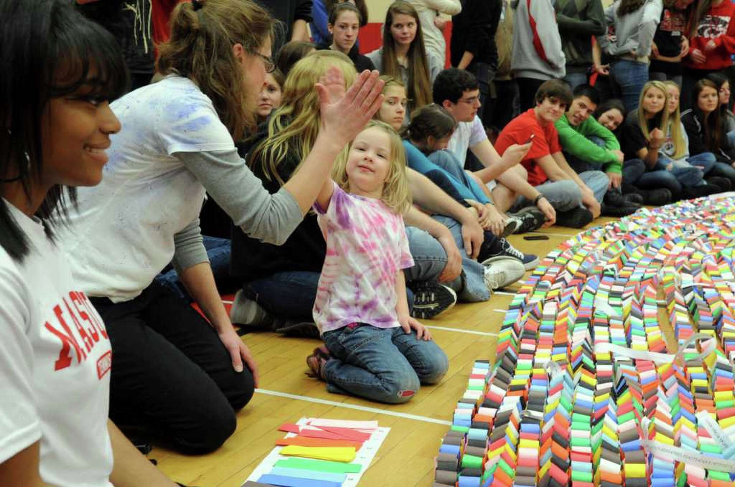 Masuk students construct record-breaking pi paper chain