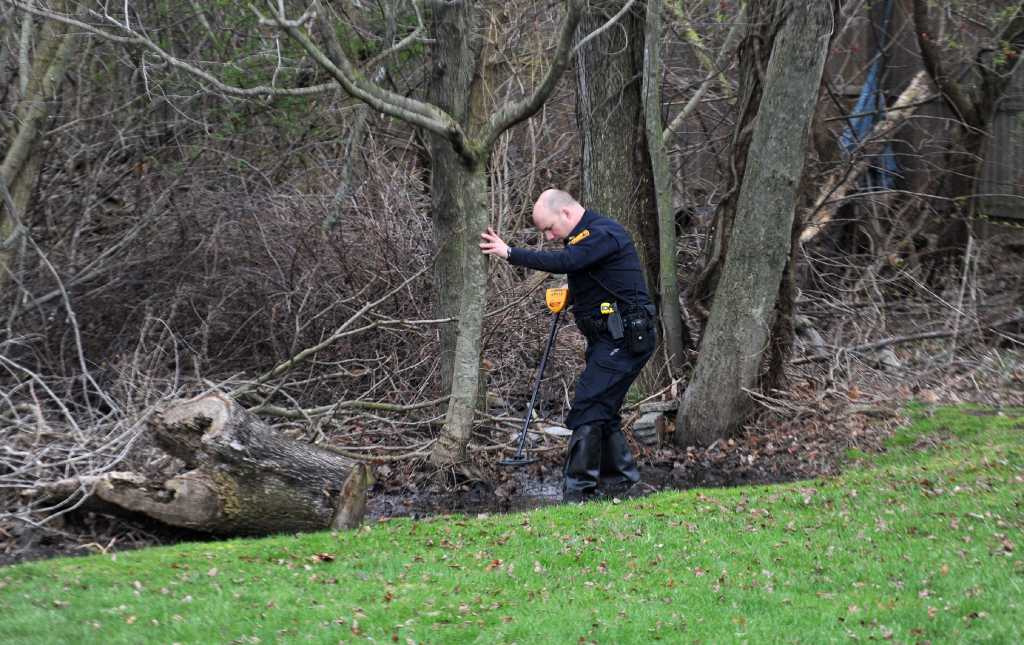 Bridgeport police wade through swamp for discarded gun