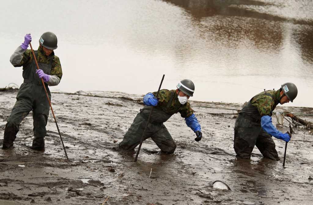 With 12,000 still missing, Japan keeps searching