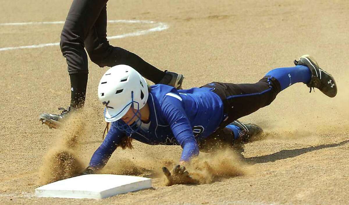 Softball Players Sliding