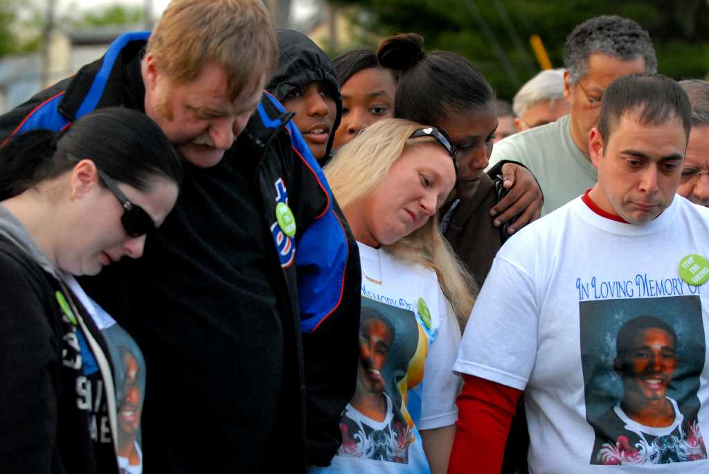 Dozens urge end to violence at scene of fatal stabbing