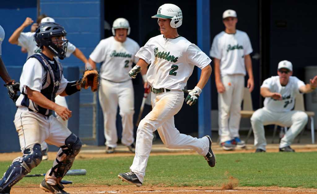 Baseball: Carroll's big rally ends Reagan's season