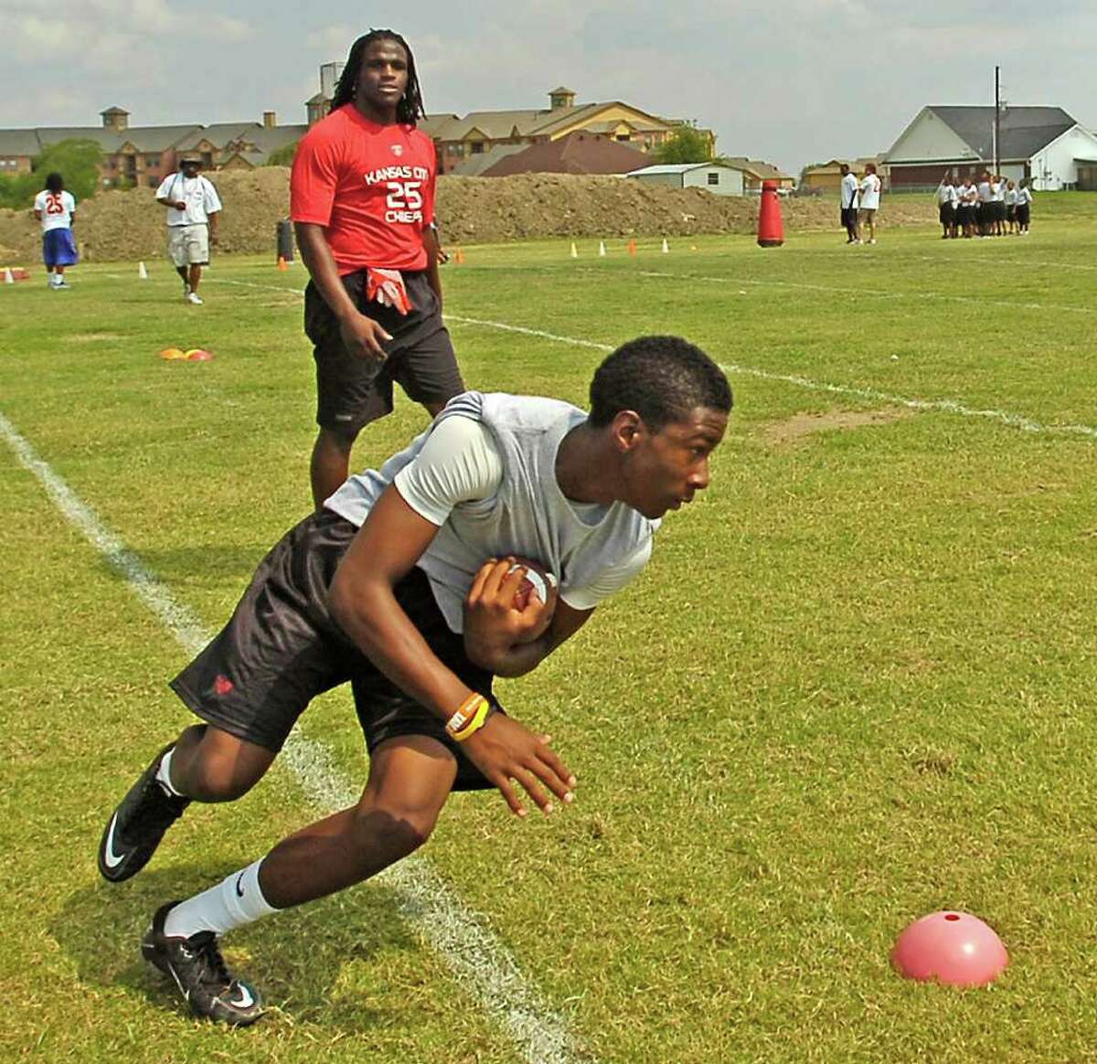 Charles conducts football camp in midst of NFL lockout