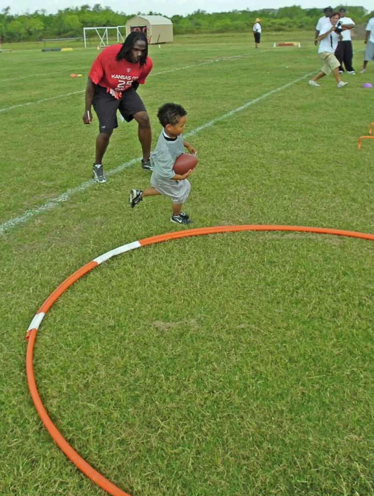 Charles conducts football camp in midst of NFL lockout