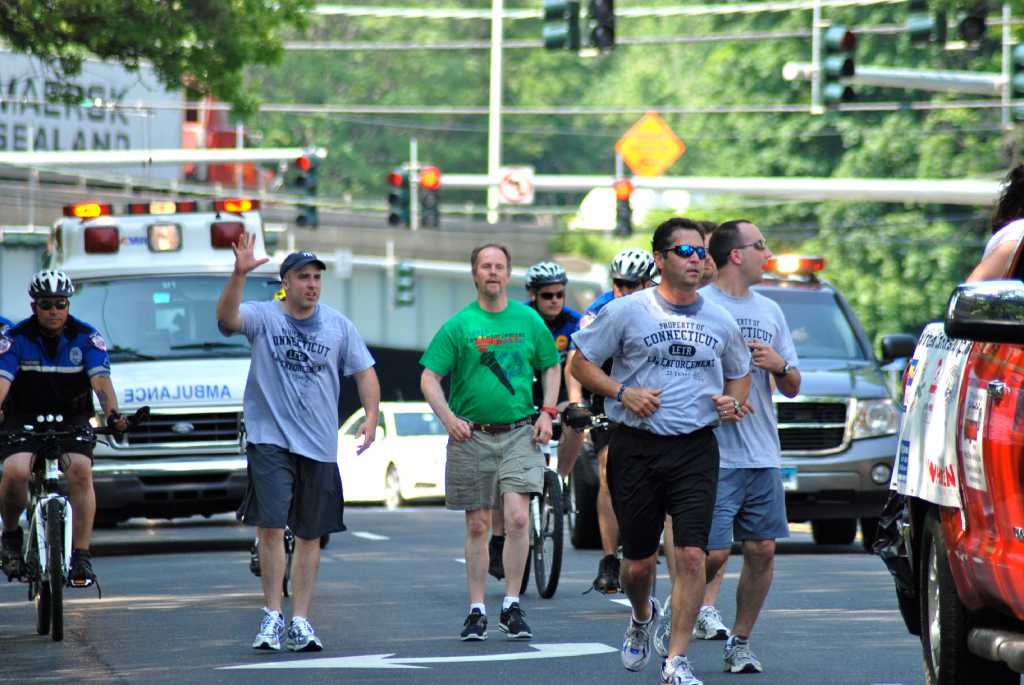 New Canaan officers participate in torch run to kick off Special Olympics