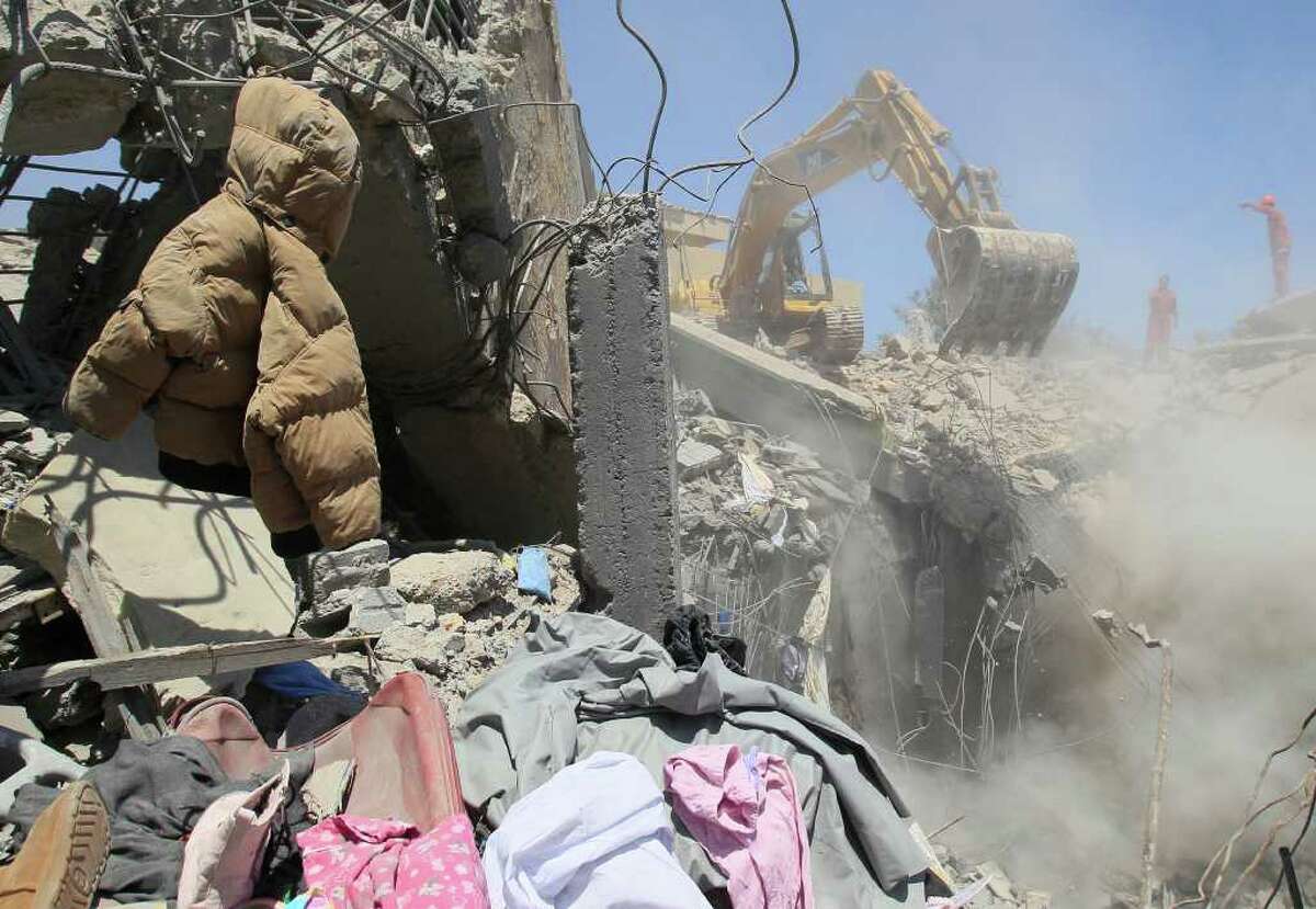 Libya says NATO airstrike kills 15 west of capital