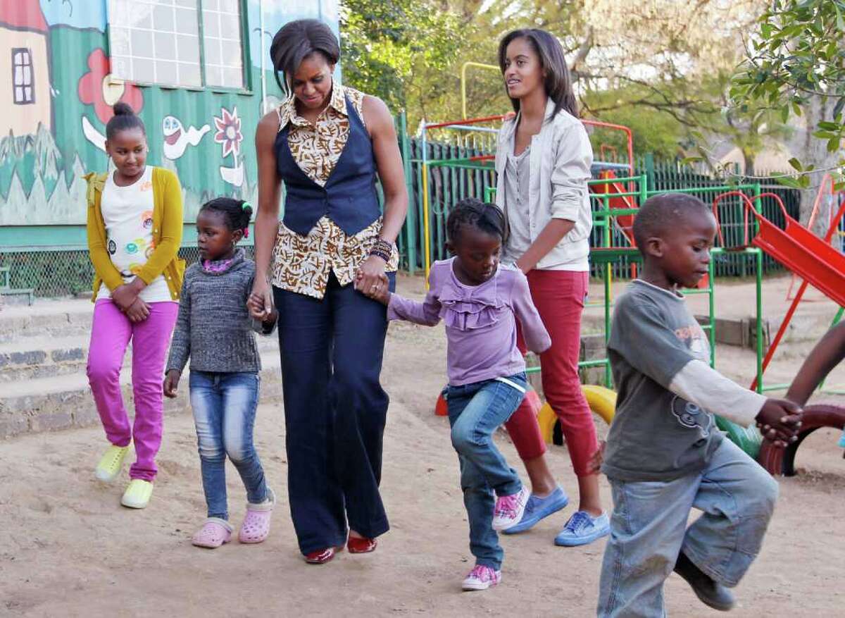 Michelle Obama, family, meets with Nelson Mandela