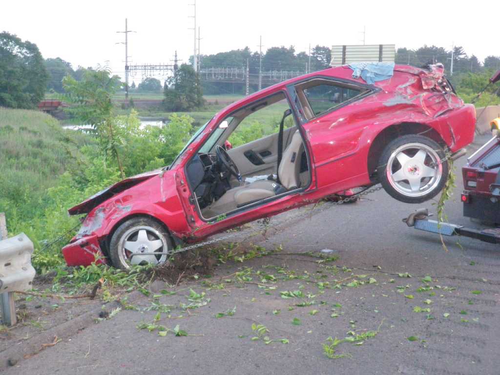 Car flies off I-95 after plowing through guardrail