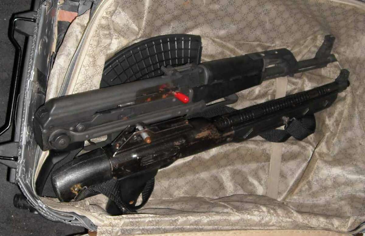 Police arrest 29, seize drugs and guns in early-morning sweep