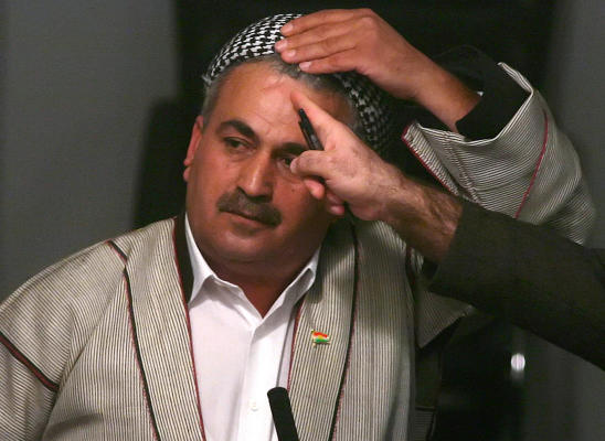 Saddam returns for second trial urging reconciliation