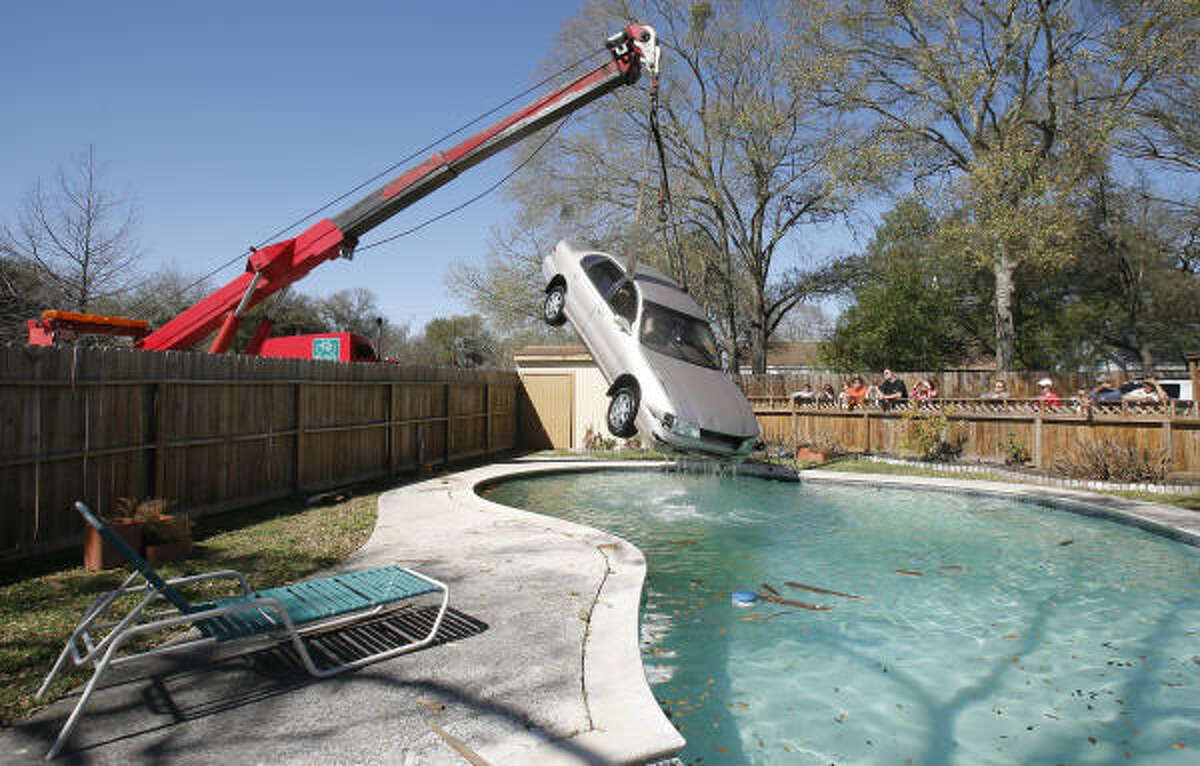 Car driven into backyard pool in west Houston