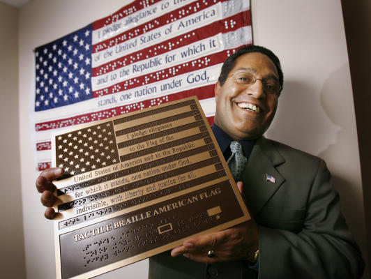 Son designs Braille-inscribed U.S. flag for blind veterans