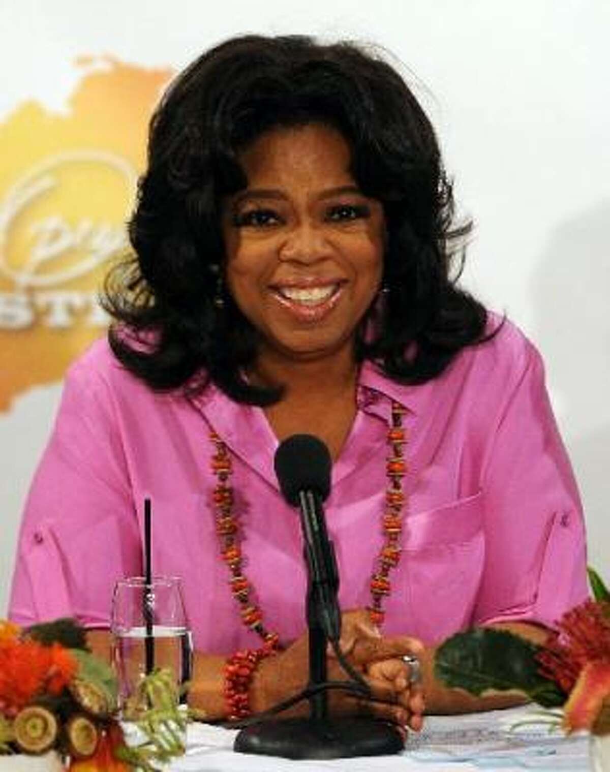 Oprah spreads upbeat message with new network, OWN