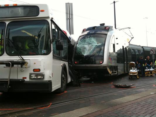 9 hospitalized after Metro train, bus collide downtown