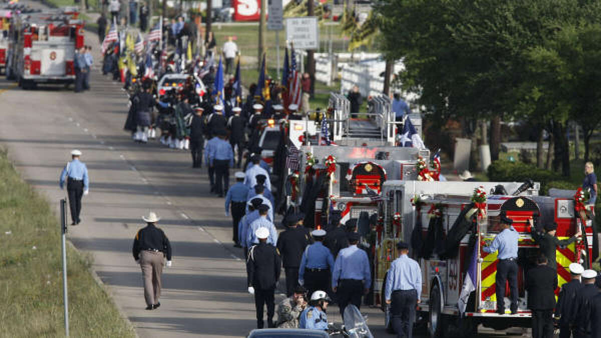 HFD marches to salute 2 comrades who died at fire