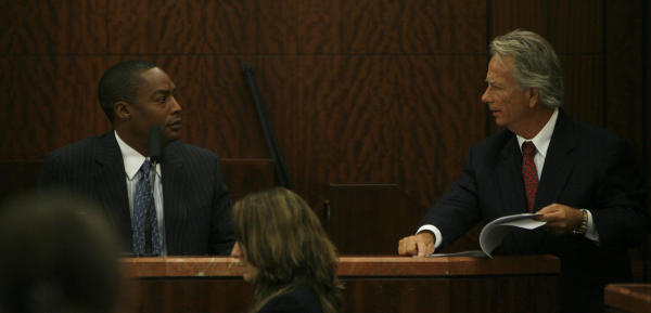 Defense puts focus on Slade's authority