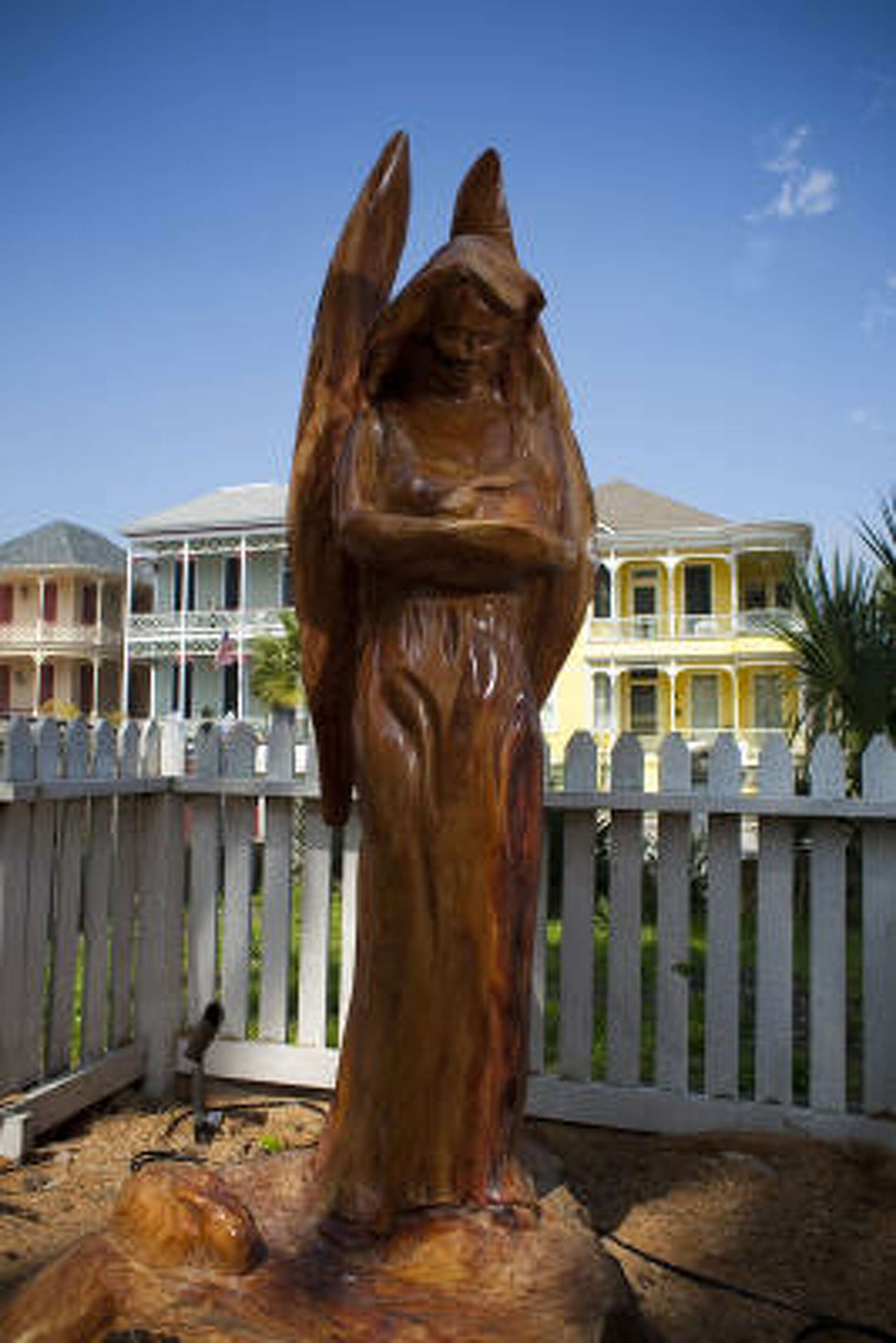 Sculptures from remains of trees lost to Ike help Isle reclaim charm