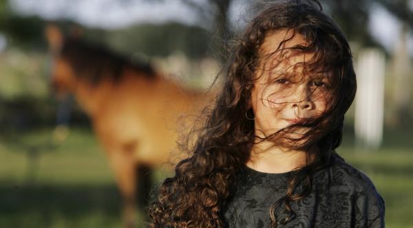 Native American boy's long hair ruffles Needville ISD