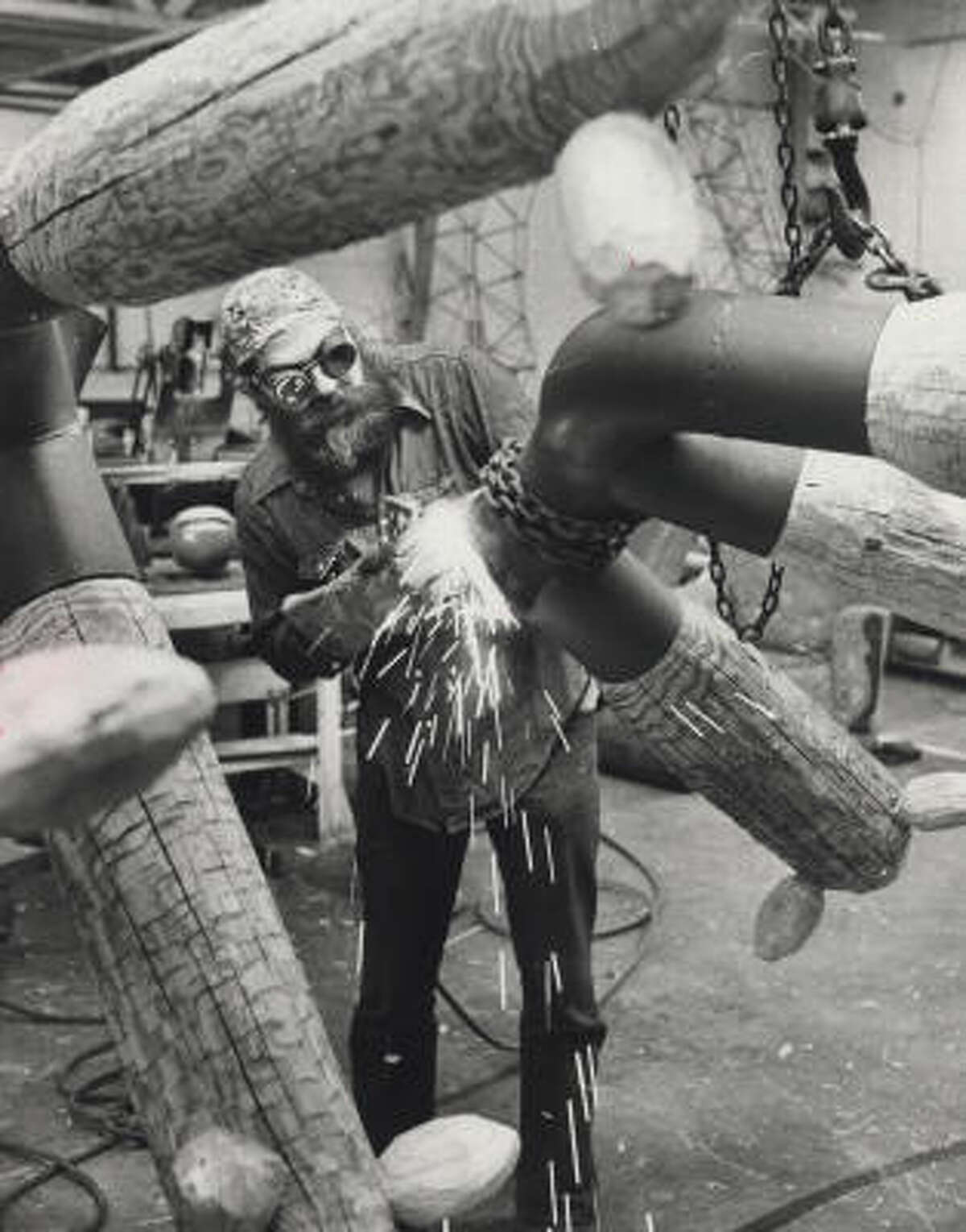 'James Surls walking in the door with a chainsaw'