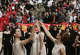 Olympic torch re-lit, begins around-the-world journey