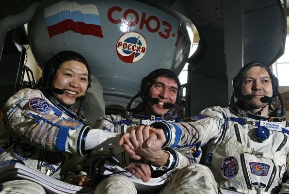 Russian follows father into space