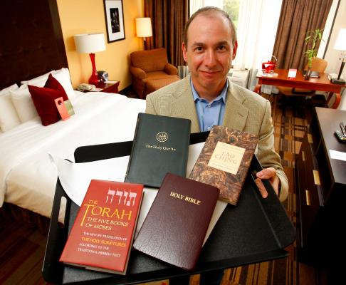 Hotels' sacred texts go beyond Gideon Bibles