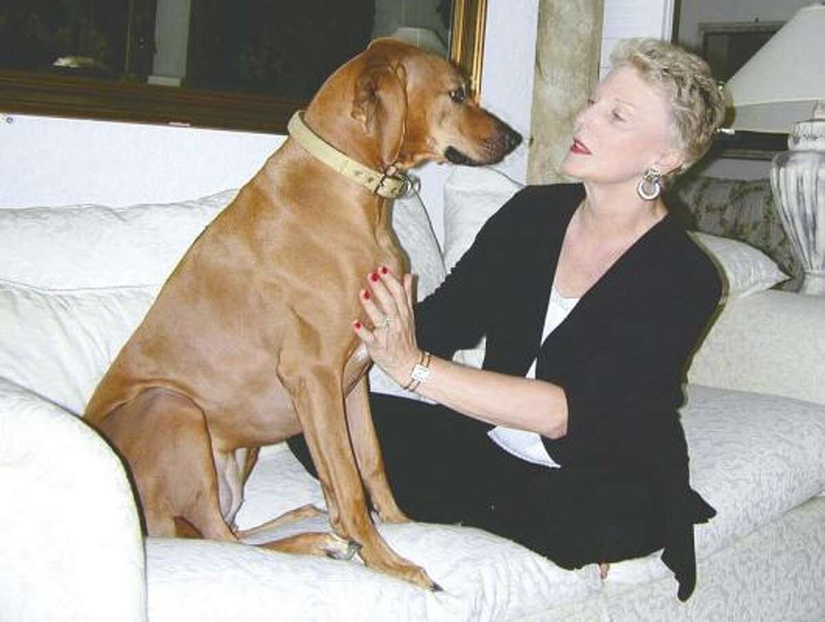 Faces in the crowd: Woman talks to the animals (with photos)