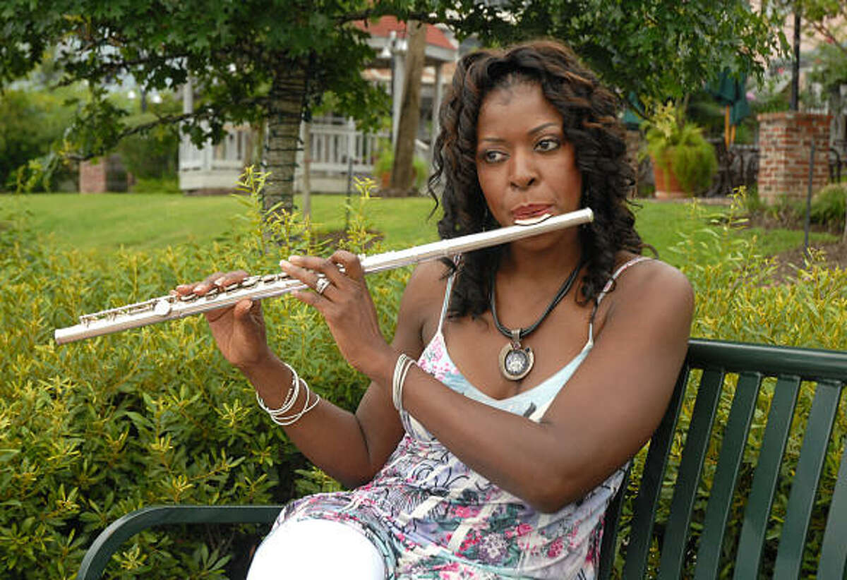 FACES IN THE CROWD: Althea Rene lets her flute do the talking