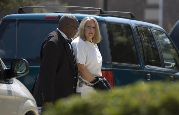 Ex-prison nurse gets life term in guard's death