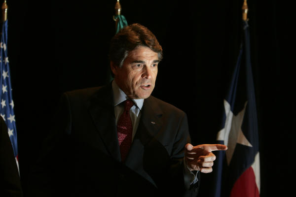 On Mexico trade trip, Perry blasts border policies