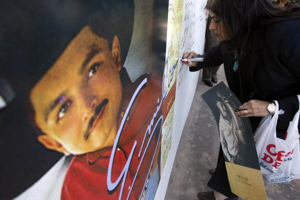 Emilio's fans gather to pray and wait