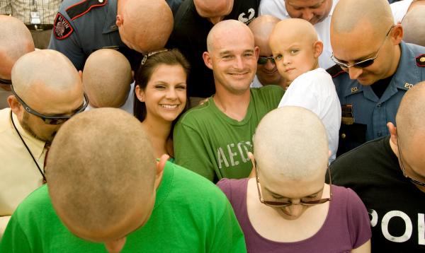 Alvin police officers shave heads to help a friend in need