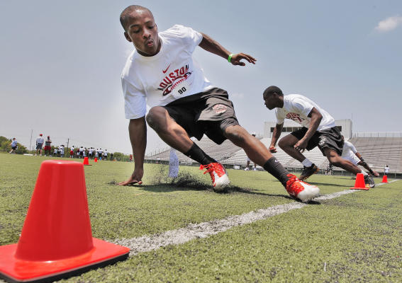 College football camps travel state to attract talent