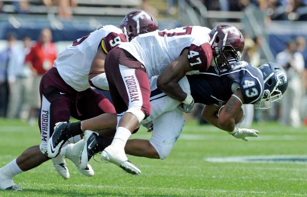 McCombs runs wild as UConn wins first game of Pasqualoni era