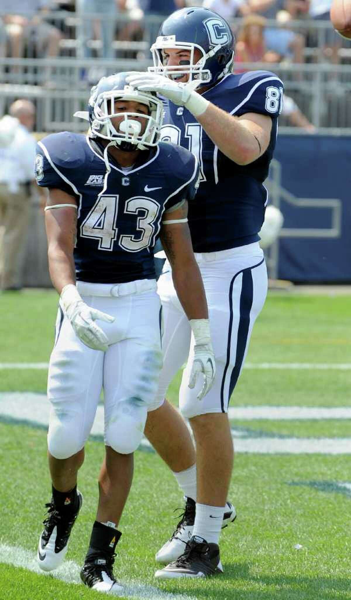 McCombs runs wild as UConn wins first game of Pasqualoni era